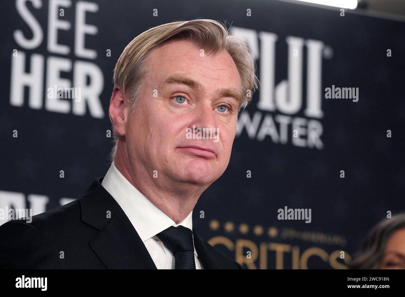 Christopher Nolan poses in the press room with the award for best ...