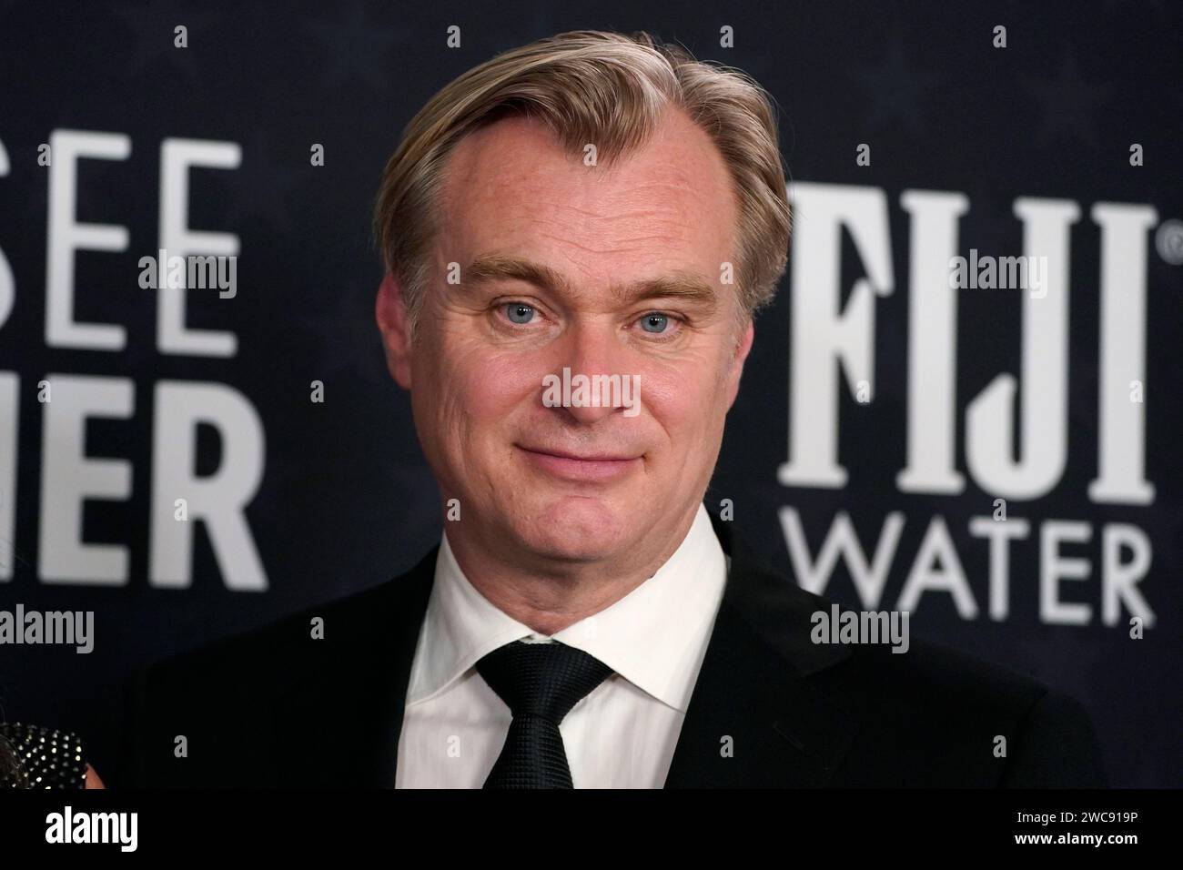Christopher Nolan poses in the press room with the award for best ...