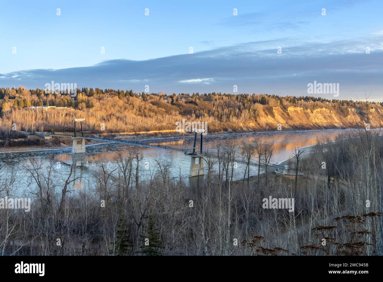 Fort Edmonton Bridge landscape in fall season with low sun light blue ...