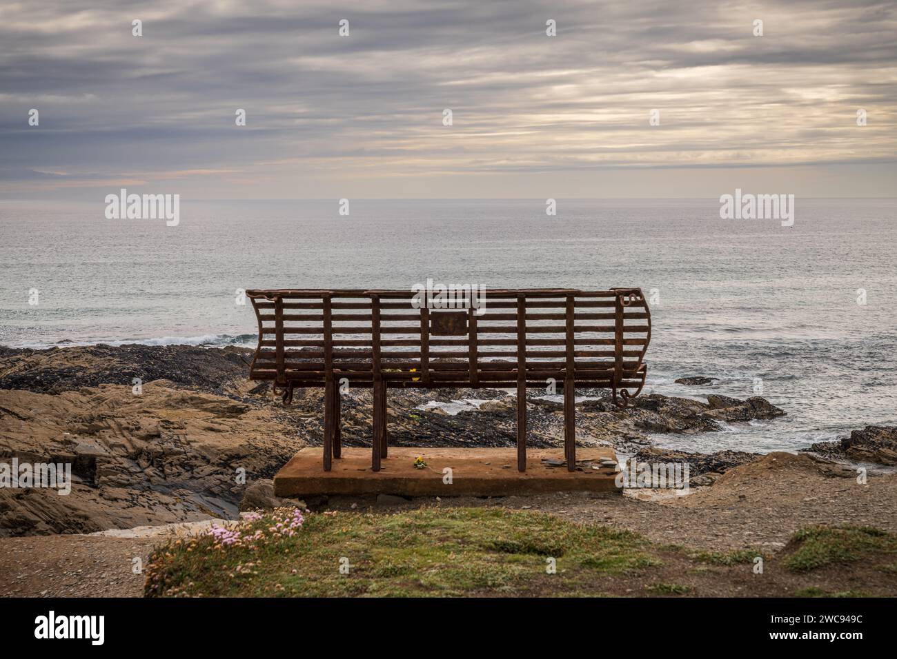 An old rusty bench in Treyarnon Bay, Cornwall, England, UK Stock Photo ...