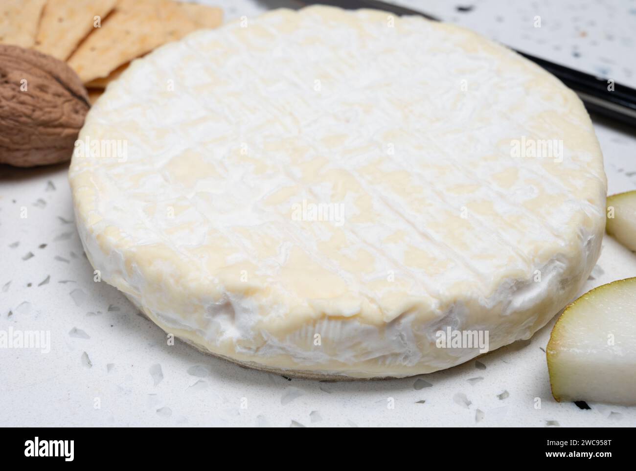 French soft Cremeux de Normandie cheese, soft creamy cheese with white ...