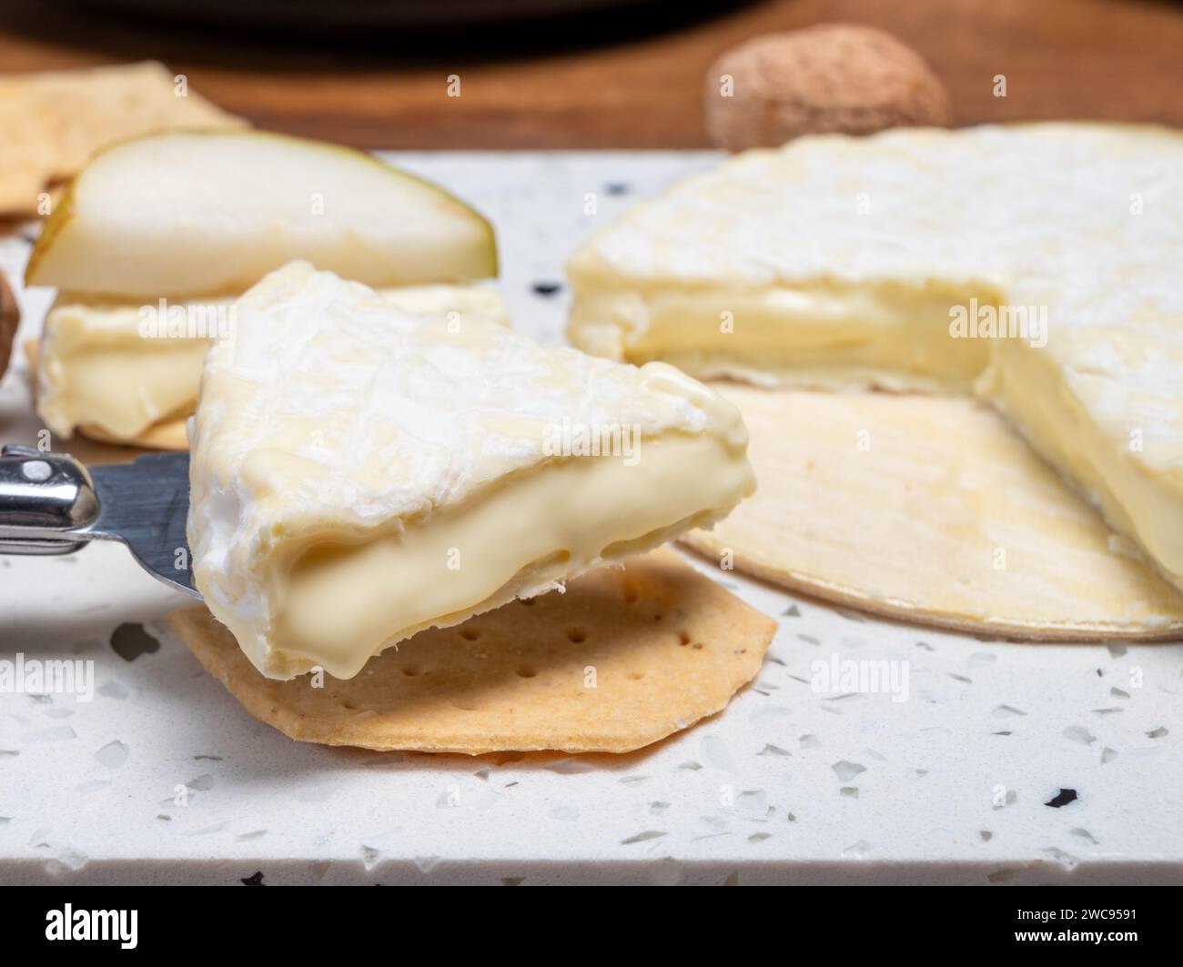 French soft Cremeux de Normandie cheese, soft creamy cheese with white ...