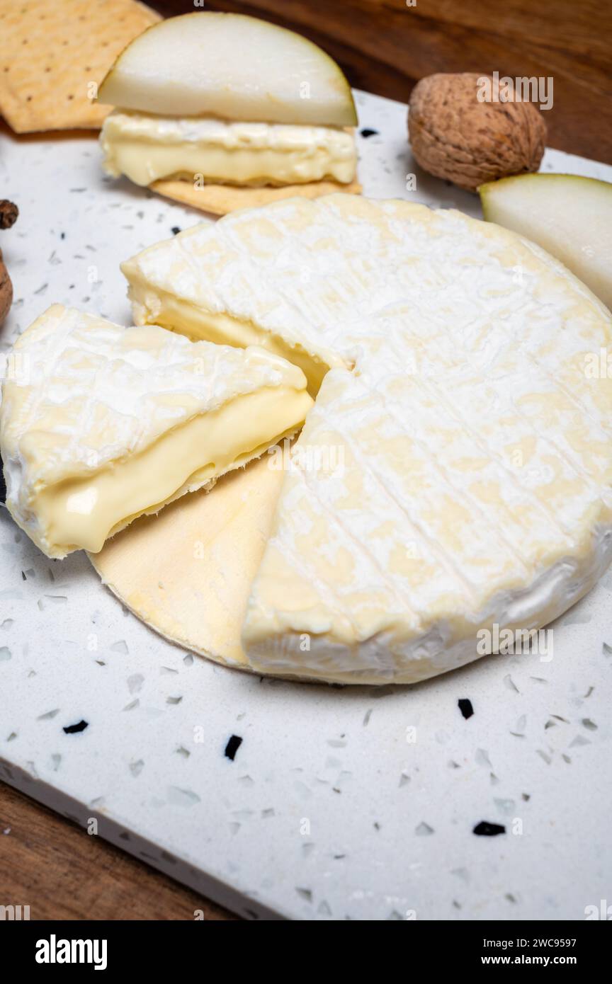French soft Cremeux de Normandie cheese, soft creamy cheese with white ...