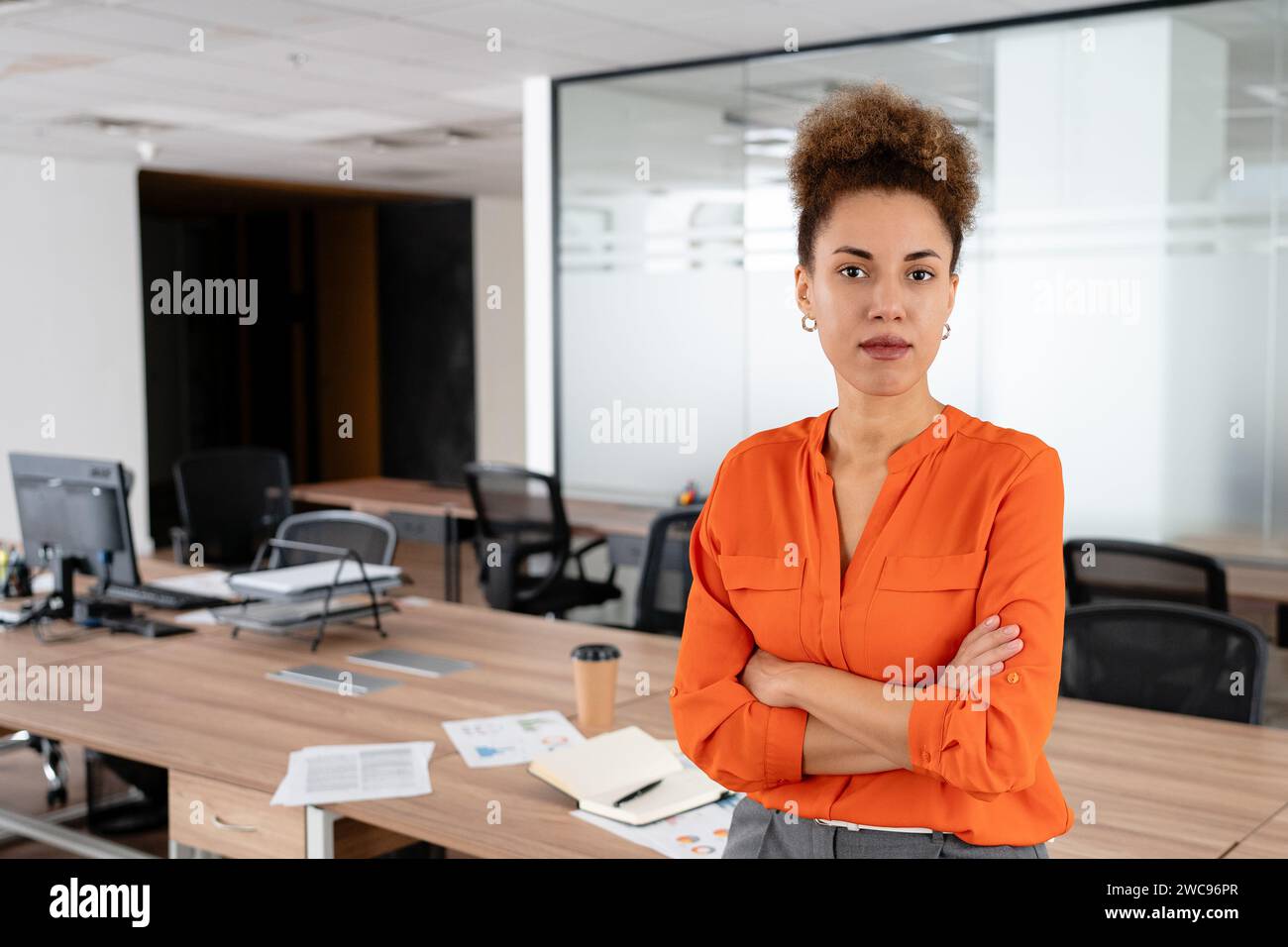 Small business entrepreneur smiling while communicating with her office ...
