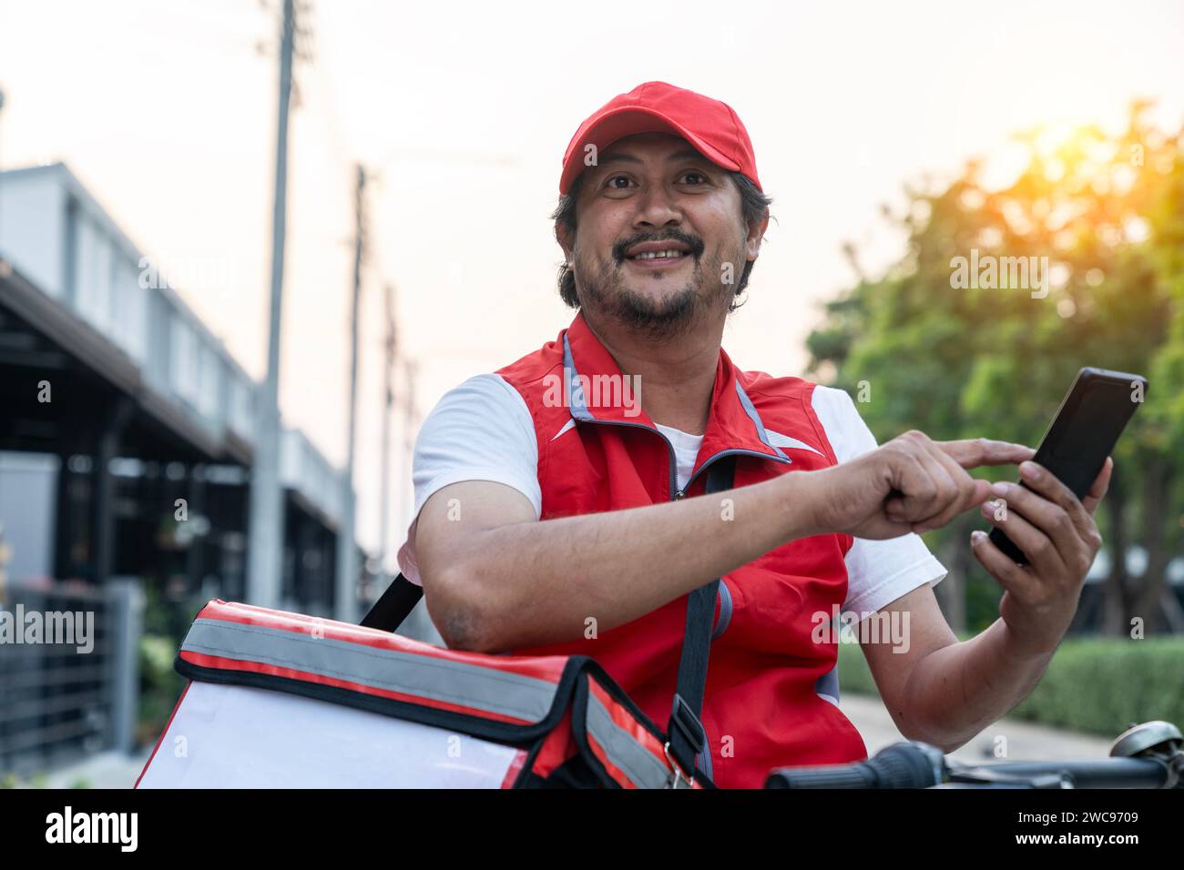 A food delivery driver showing the phone screen, inviting customers to ...