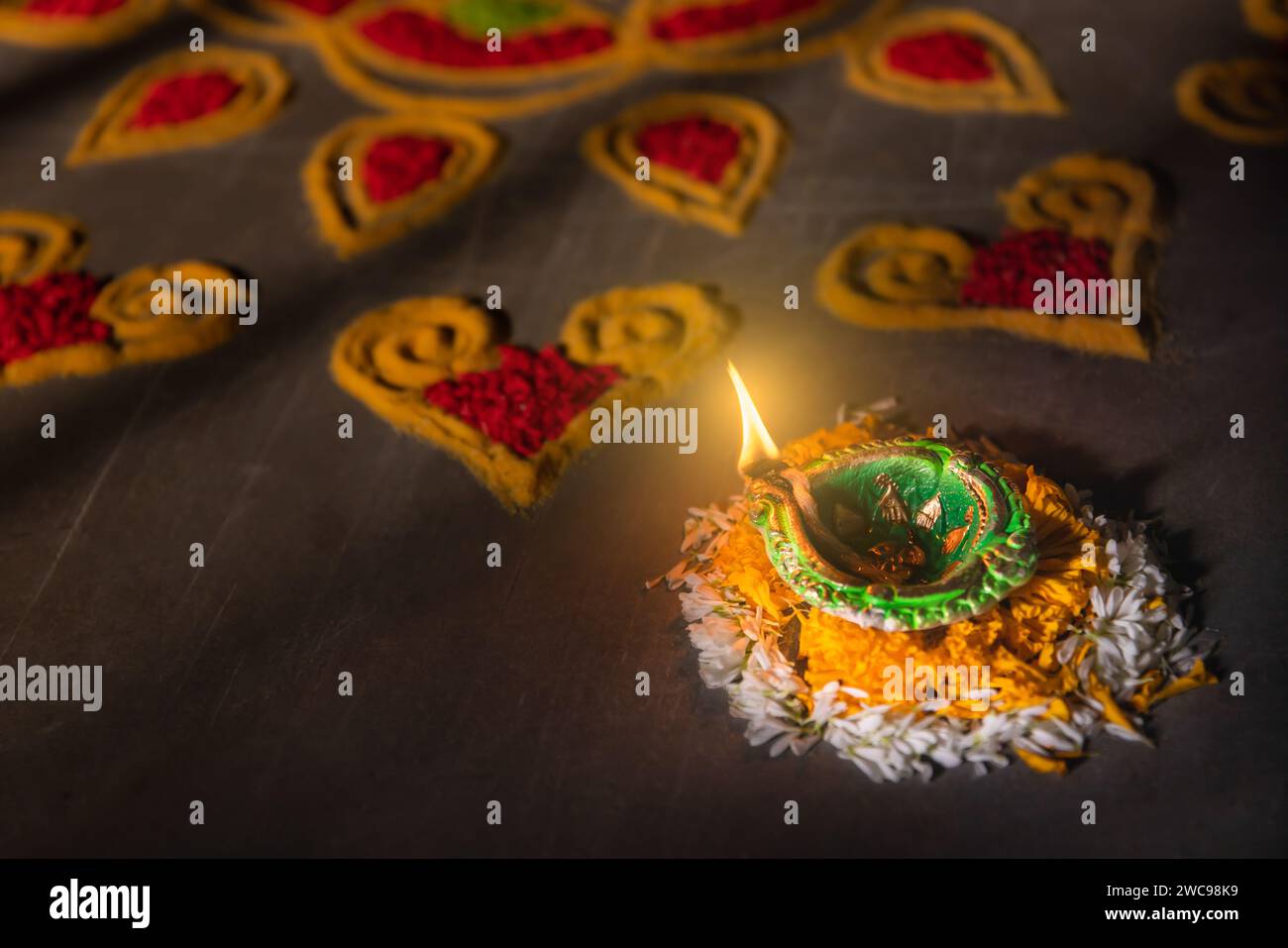 Flower rangoli with lamps hi-res stock photography and images - Alamy