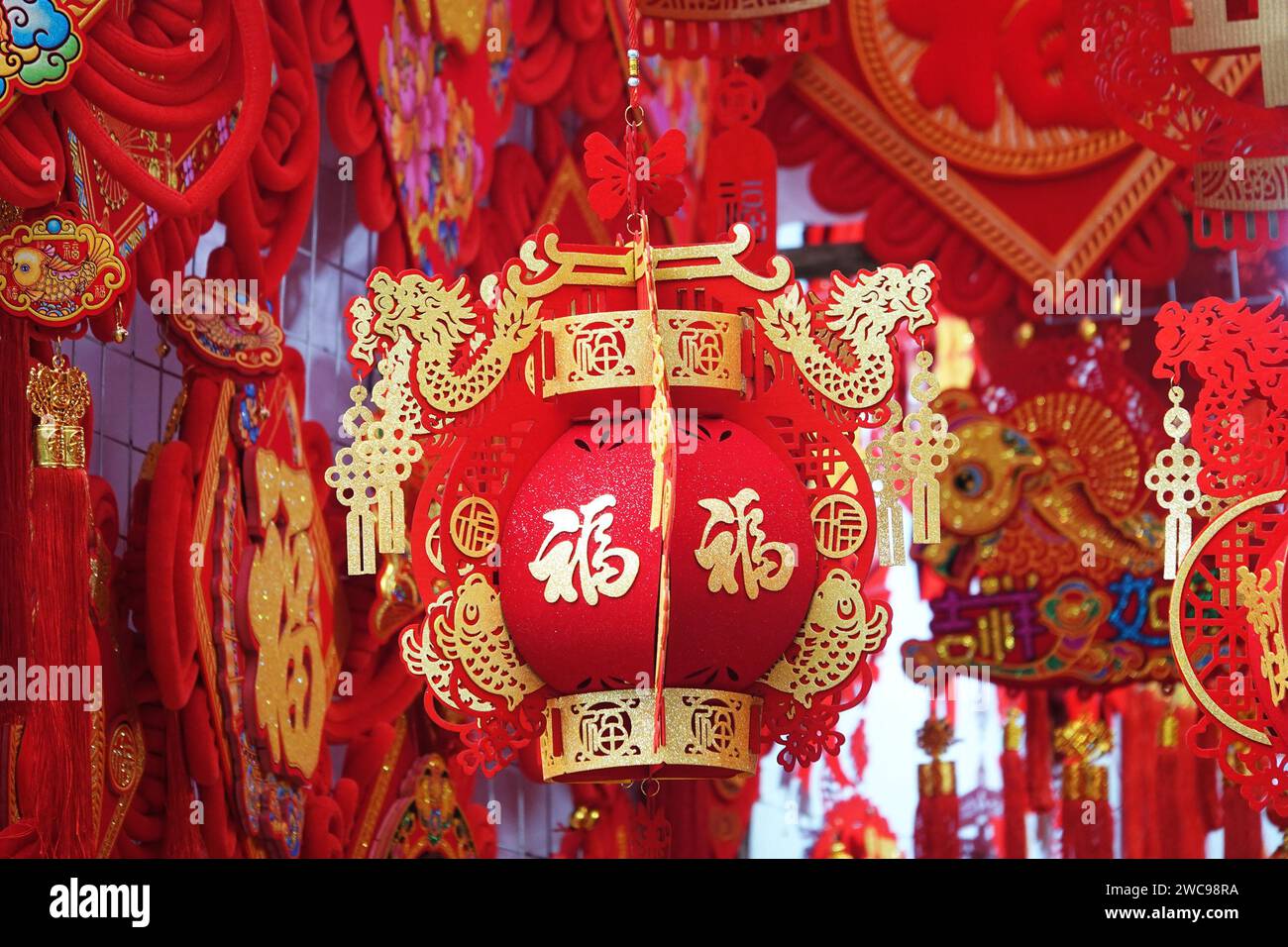 People shop Spring Festival decorations at a market in Nanning City ...