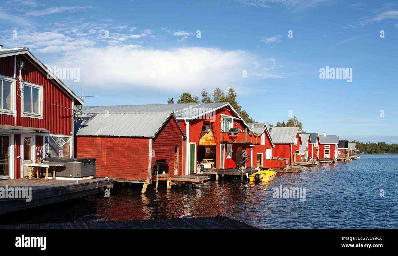 MELLANFJÄRDEN, SWEDEN ON AUGUST 14, 2023. Red wooden buildings by the ...