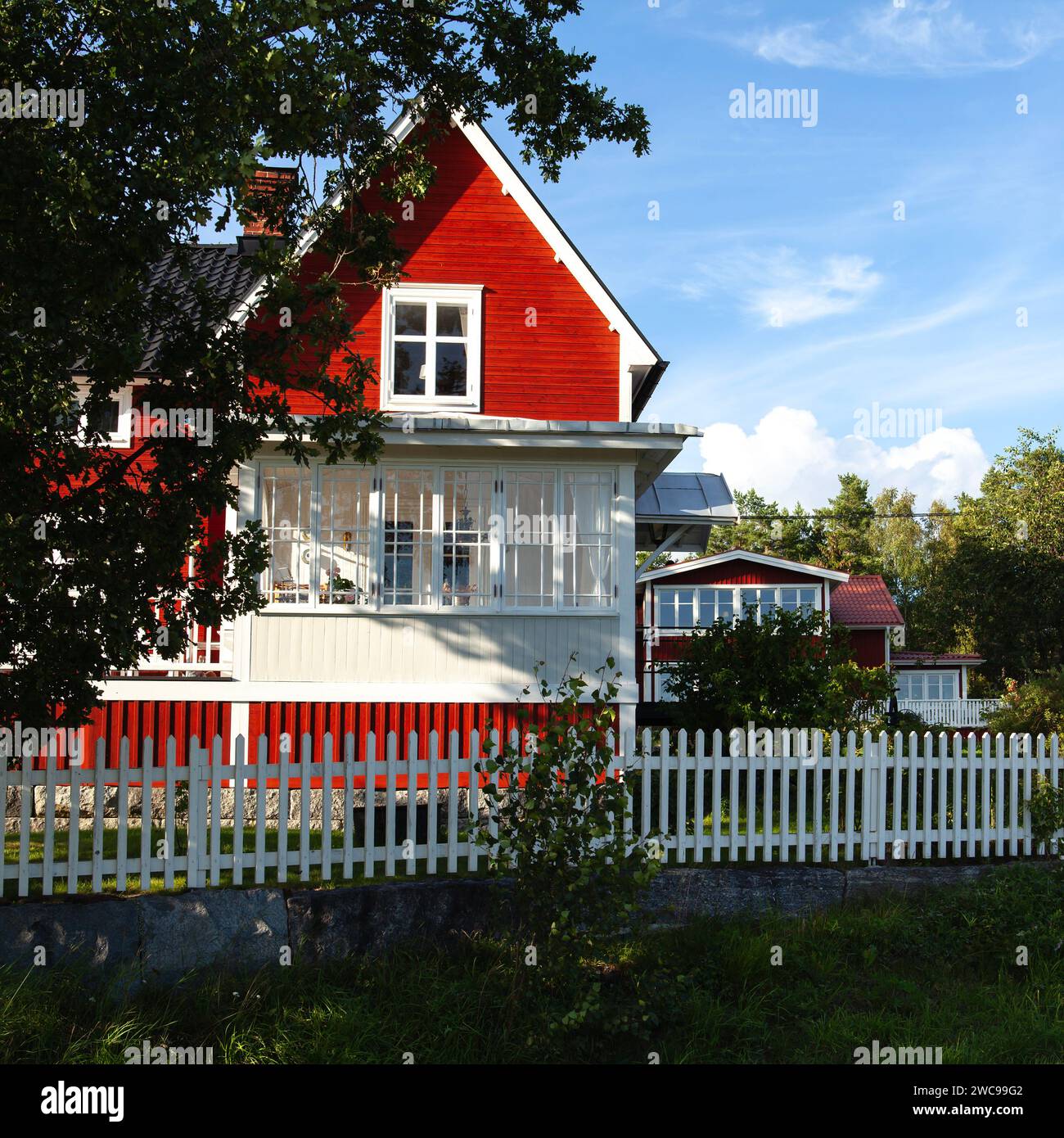 MELLANFJÄRDEN, SWEDEN ON AUGUST 14, 2023. Red wooden buildings by the ...