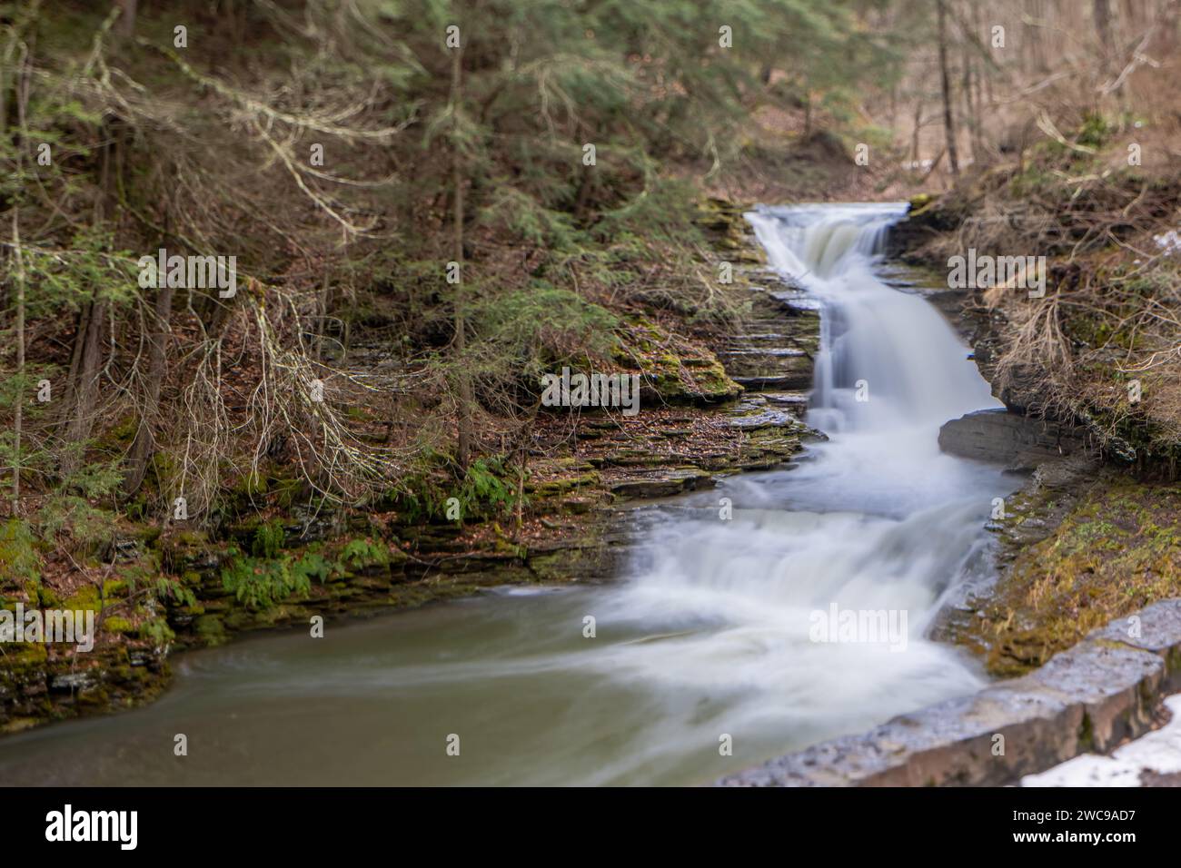 Afternoon winter photo of a waterfall in Robert H. Treman State Park ...