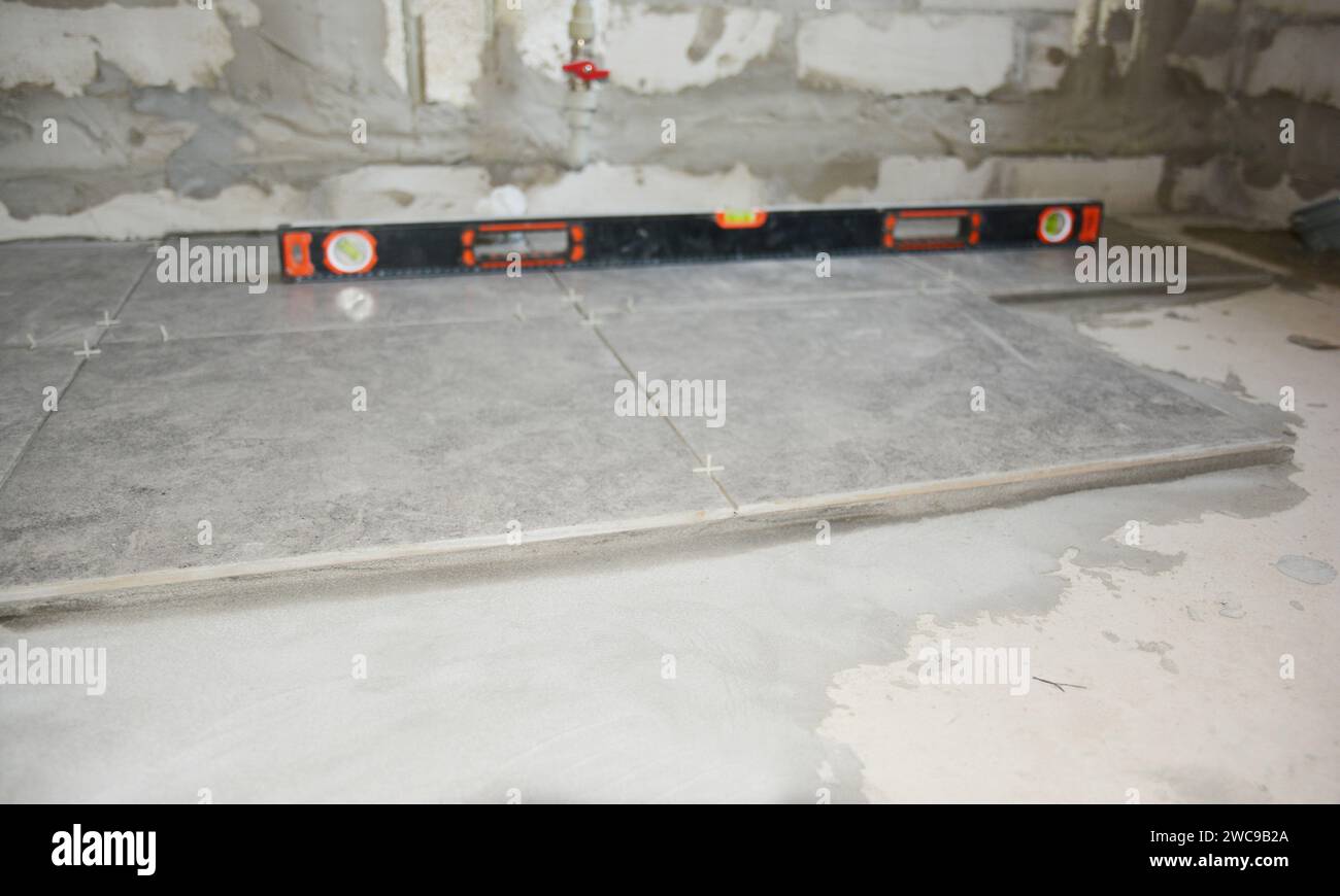A close-up on large square natural stone, soap stone slip resistant ...