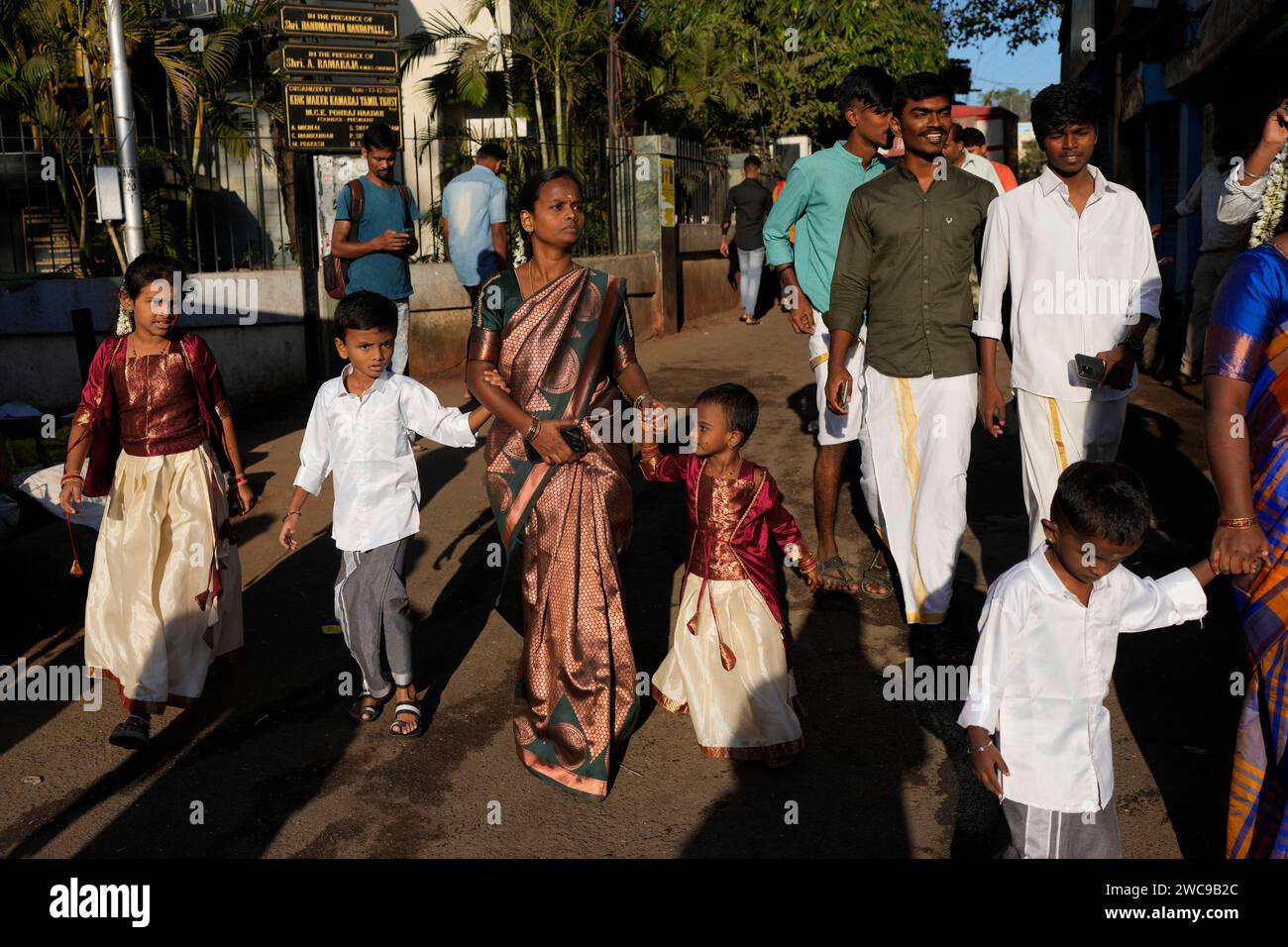 An Indian Tamil Hindu family arrives to celebrate harvest festival ...