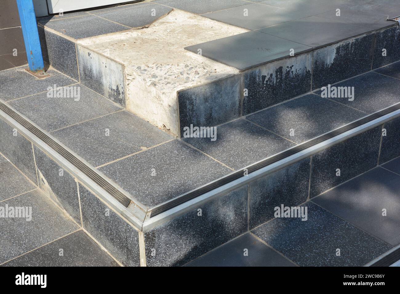 Broken tiled outside front porch stairs, steps of the house need ...