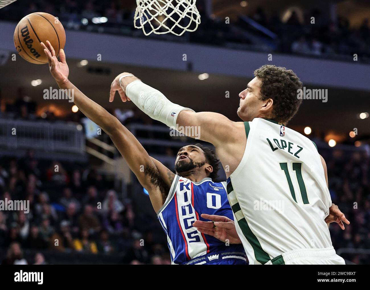 Milwaukee, USA. 14th Jan, 2024. Sacramento Kings guard Malik Monk (L ...