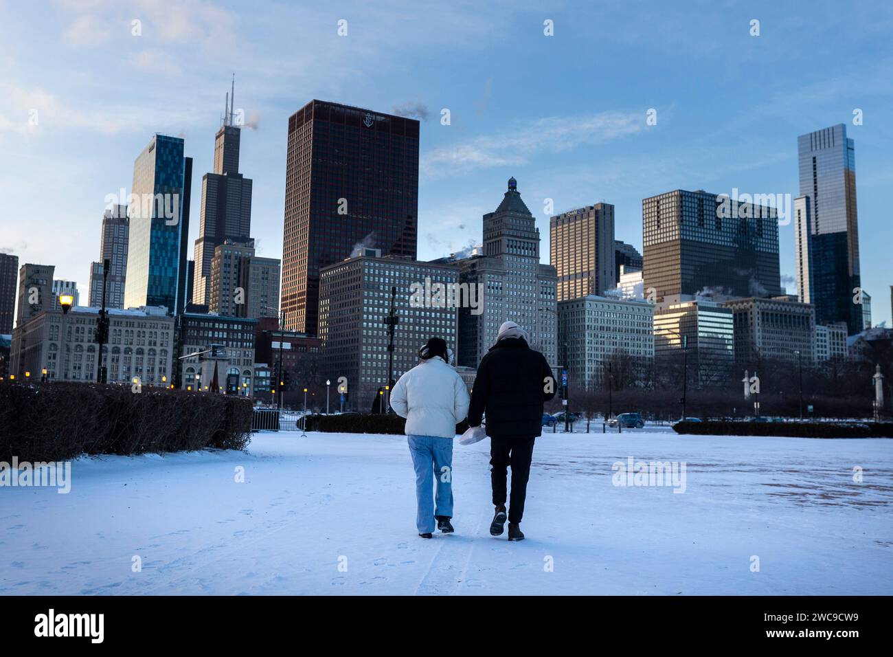 Chicago, USA. 14th Jan, 2024. A couple walks through Grant Park in ...
