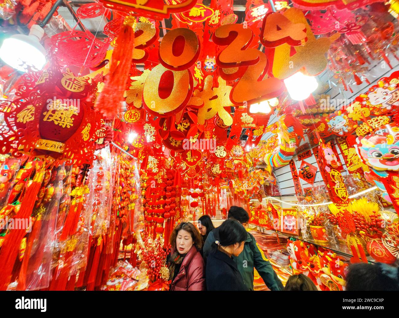 People shop Spring Festival decorations at a market in Hangzhou City ...