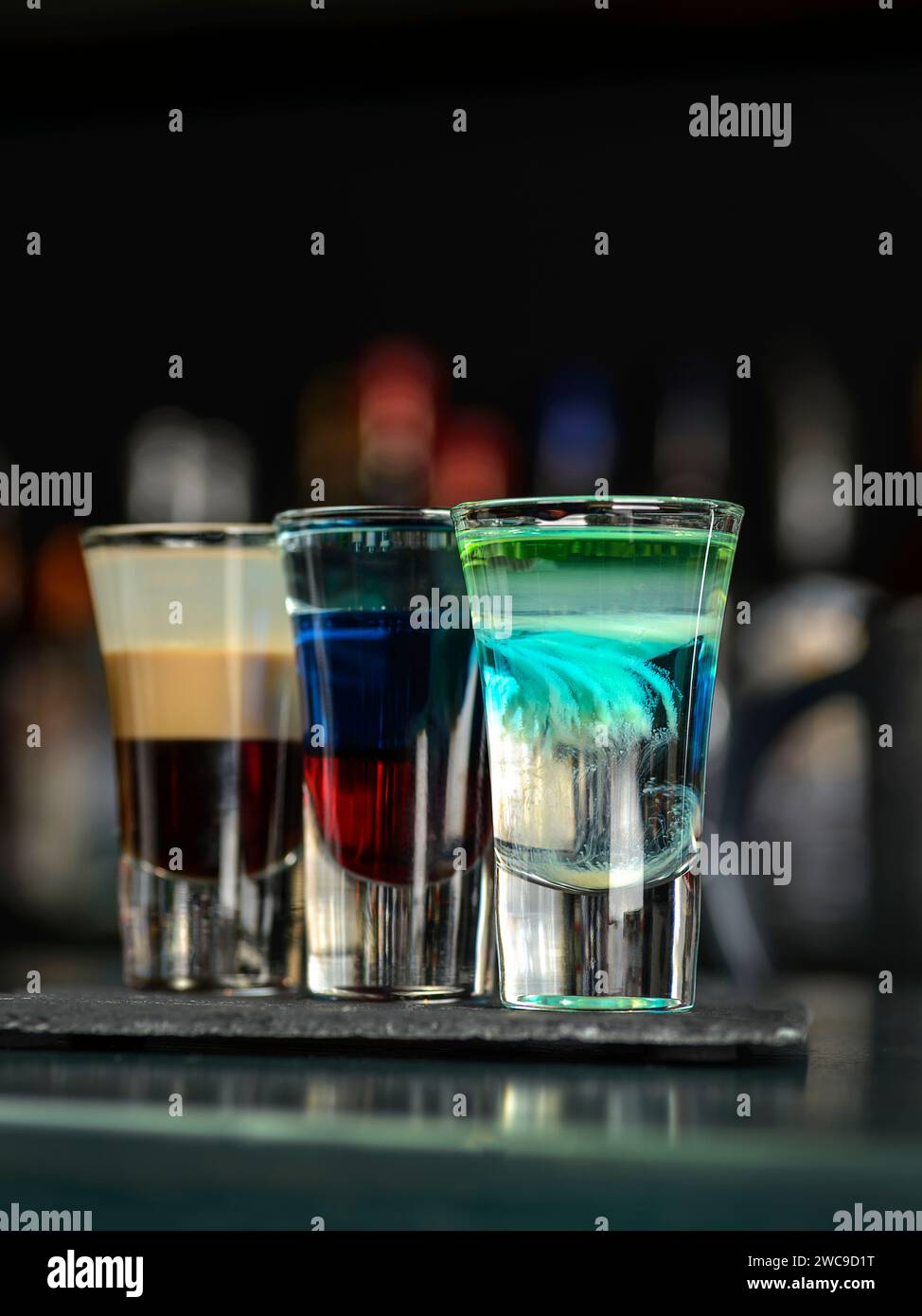 multi-layered cocktail shots at the bar Stock Photo - Alamy