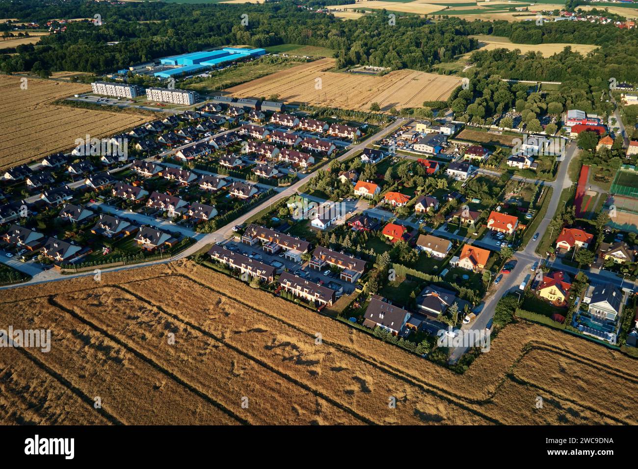 Residential houses in small town near agricultural field, bird eye view ...