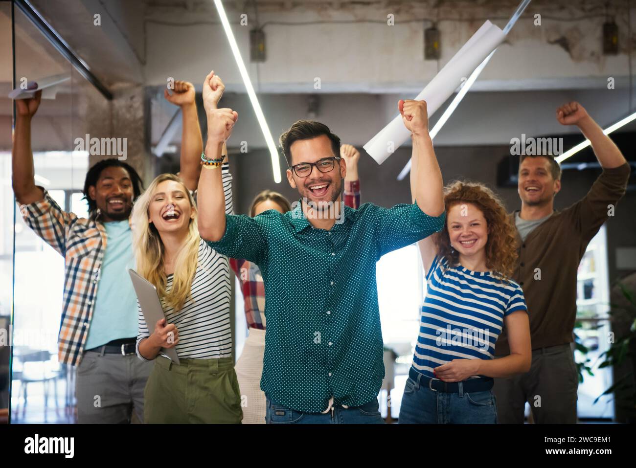 Happy diverse employees team celebrating success, business achievement ...