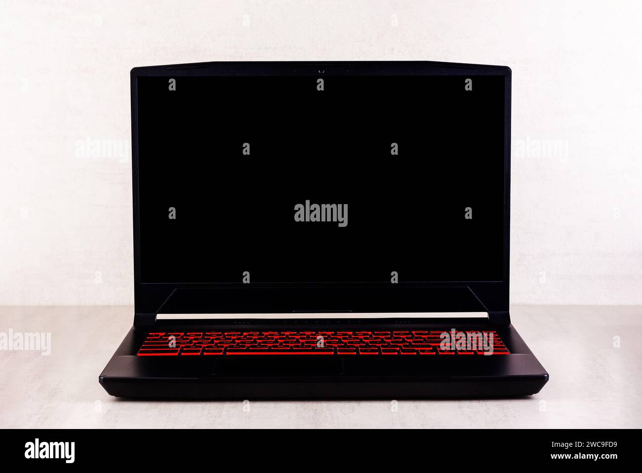 black mock up on a gaming laptop screen on a light gray background ...