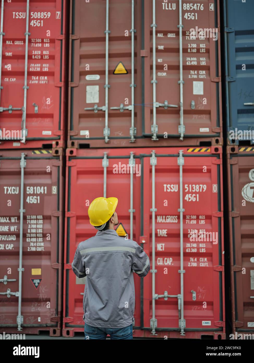 Portrait of engineer man wearing safety helmet while standing in front ...
