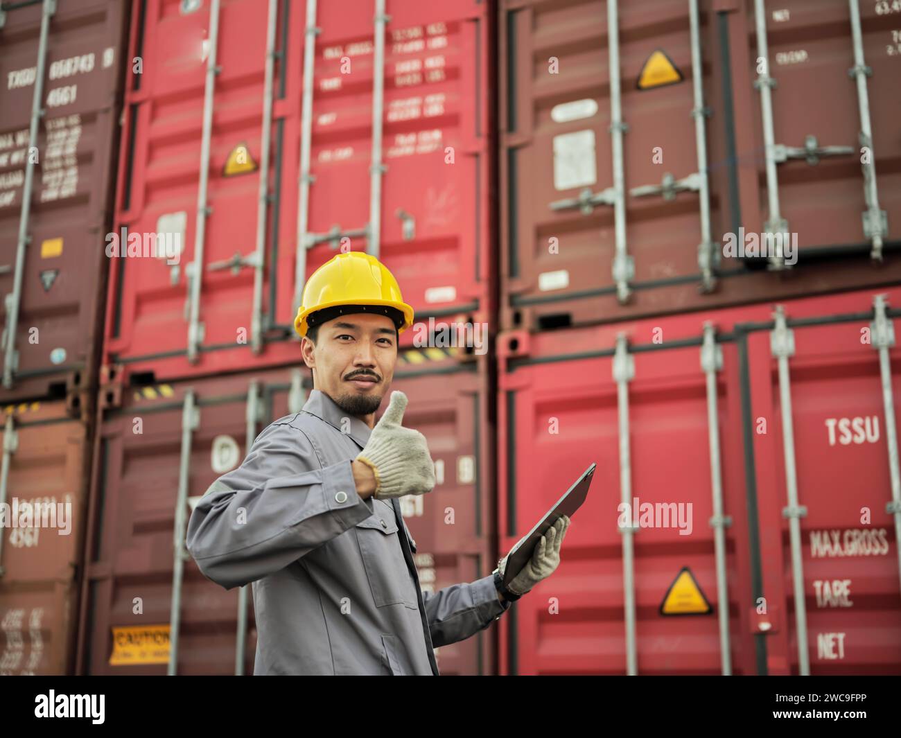 Portrait of Asian male worker wearing safety helmet working in ...