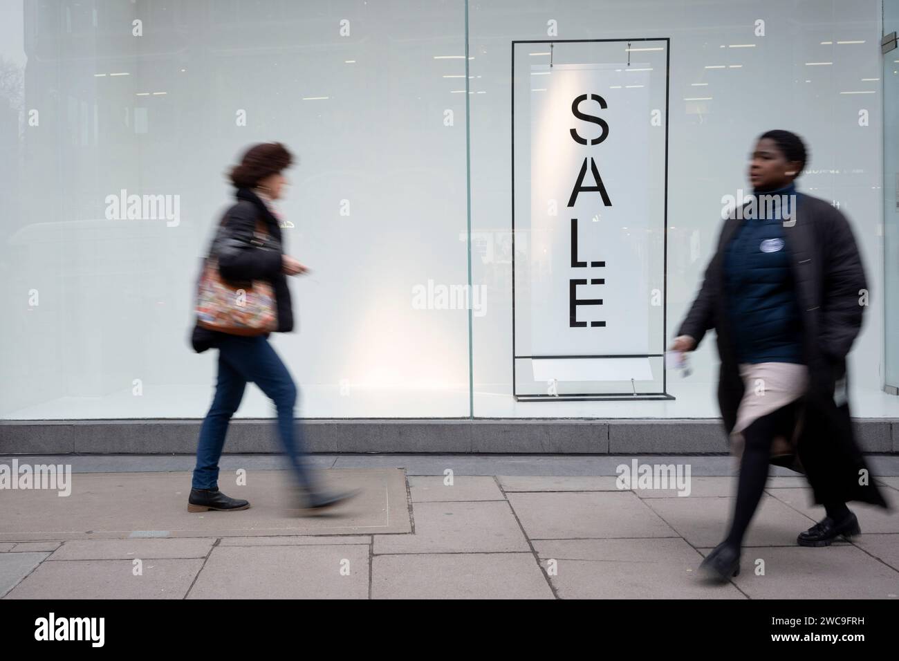 Shoppers blur past a generic shop business whose January Sales are now ...