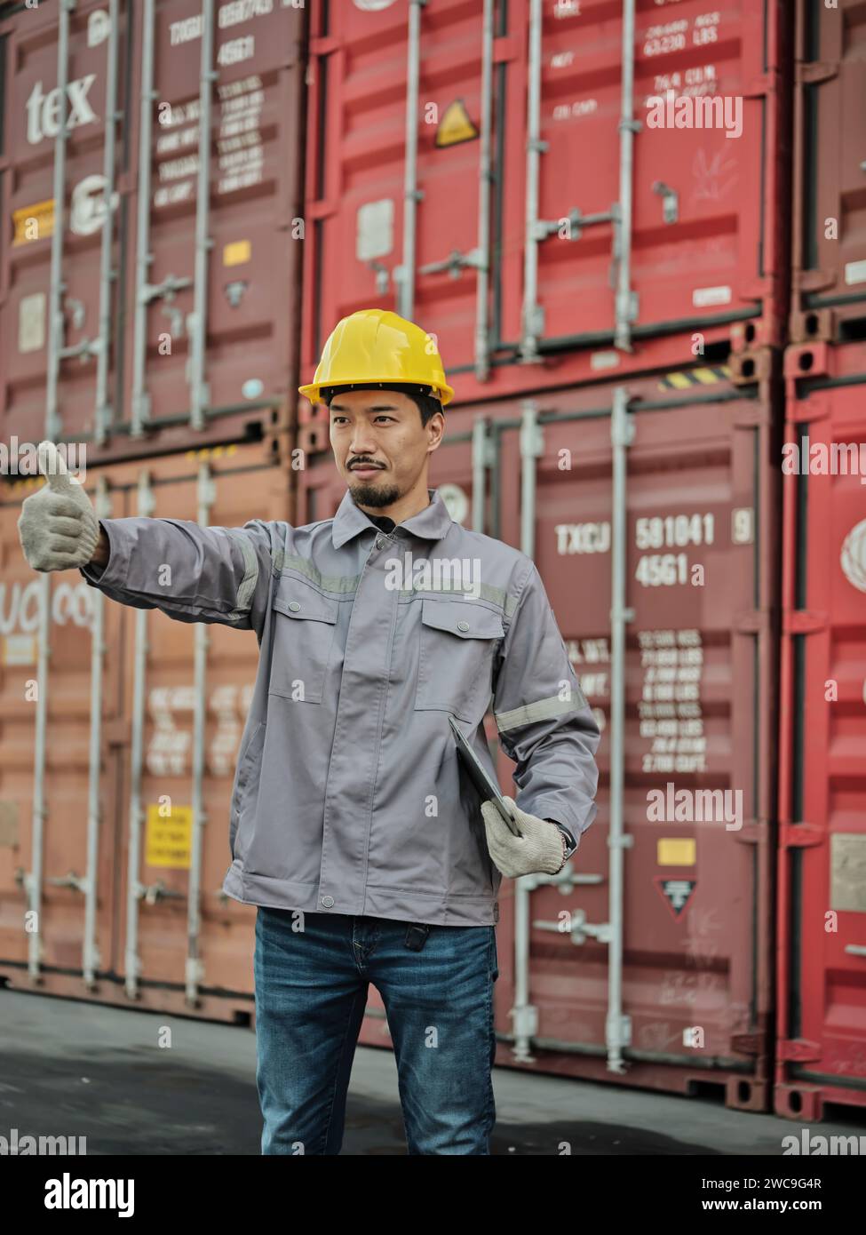Portrait of Asian male worker wearing safety helmet working in ...