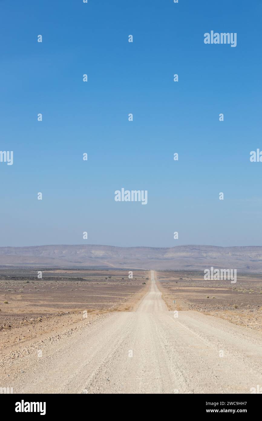 An isolated road winds through a vast desert landscape Stock Photo - Alamy