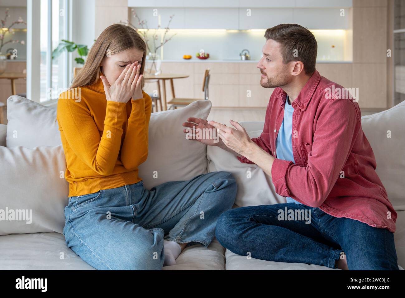 Jealous furious abused man talking screaming at crying woman wife ...