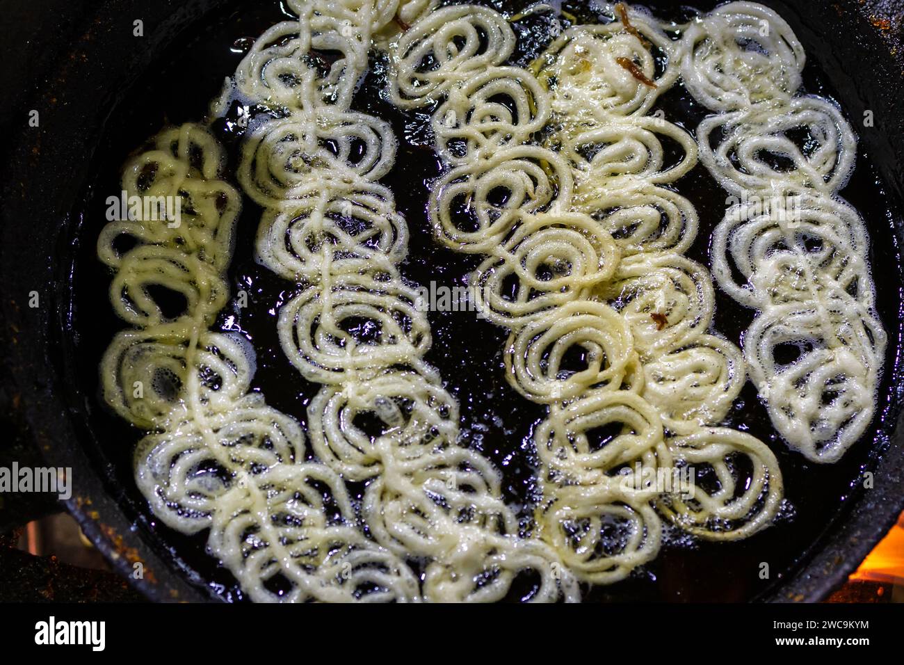 indian traditional sweet jalebi deep frying at hot refined oil Stock ...