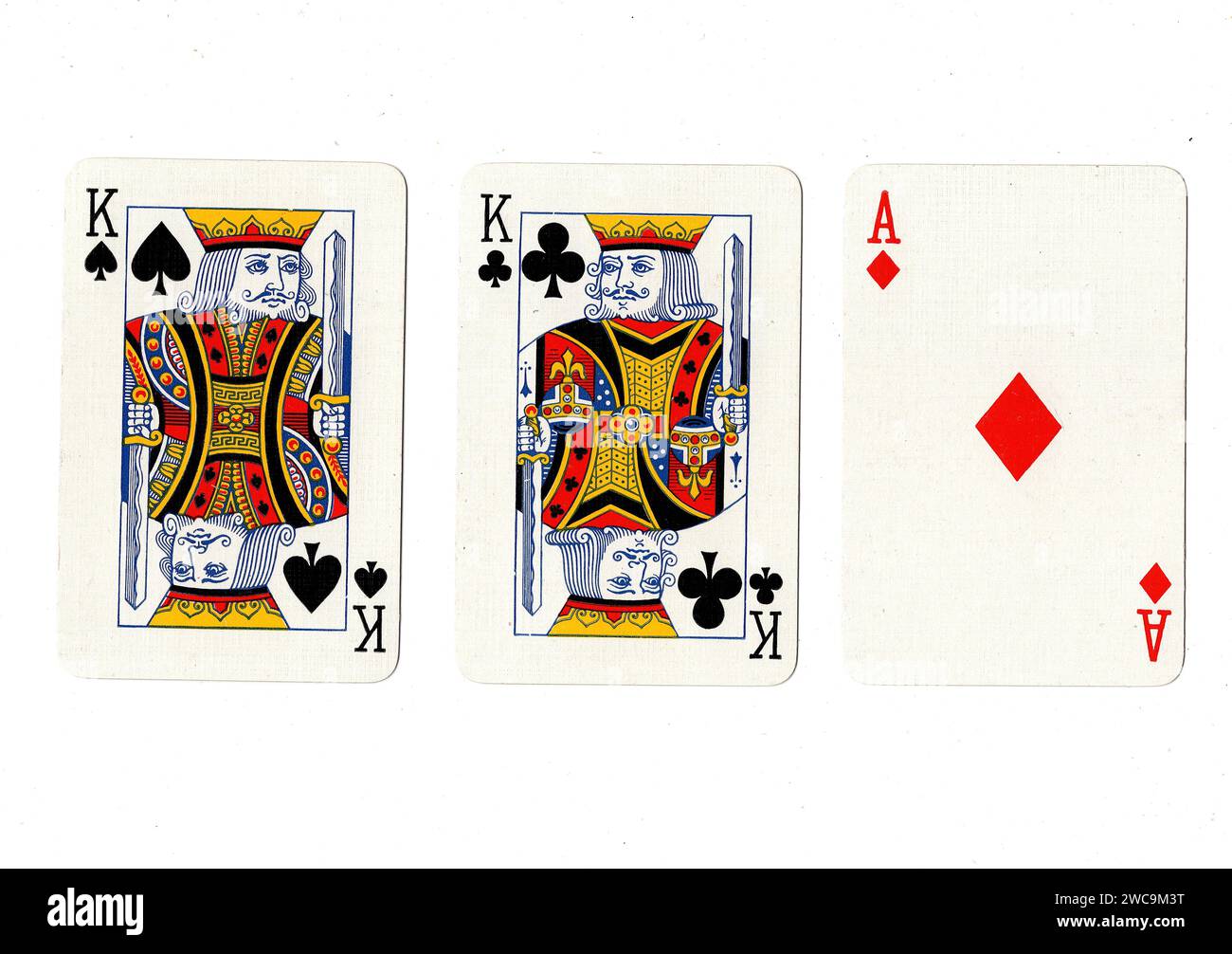 Vintage playing cards showing a pair of black kings and a red ace ...