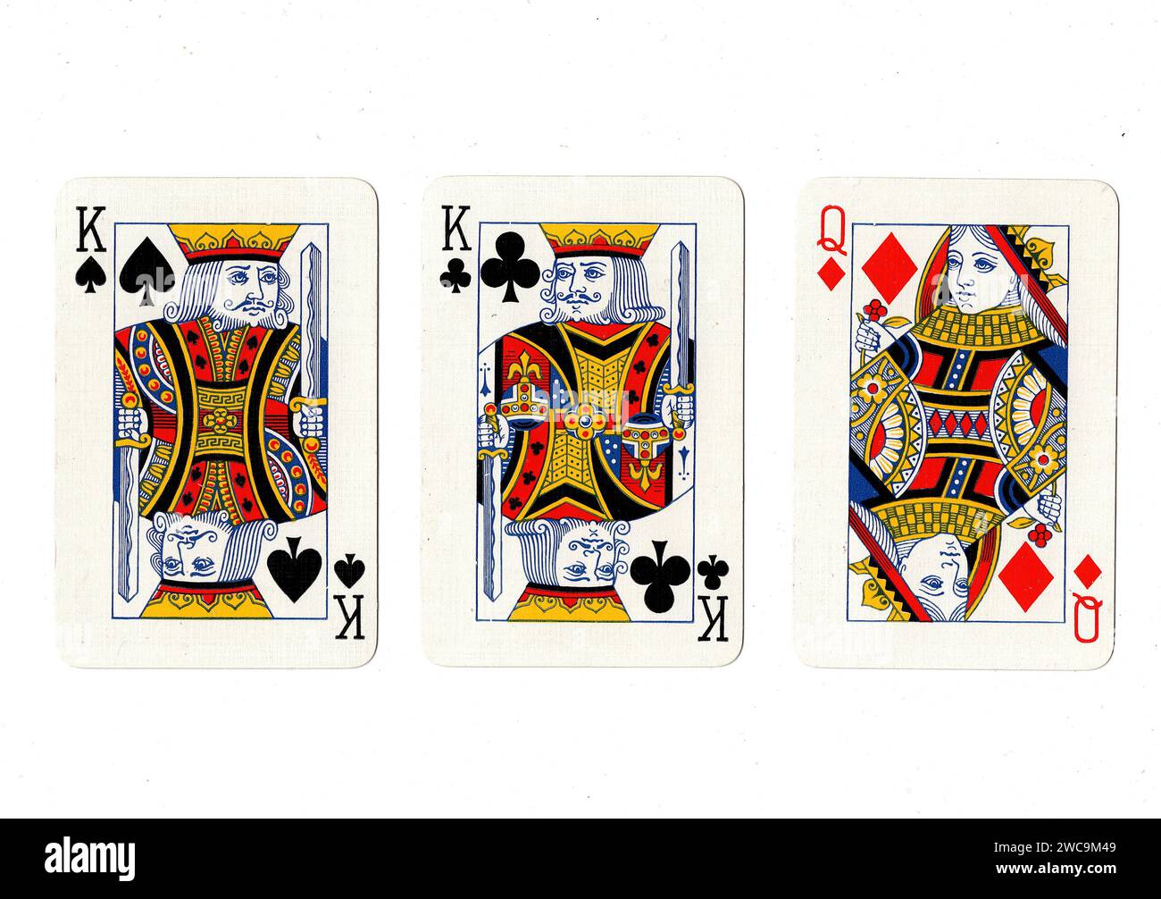 Vintage playing cards showing a pair of black kings and a red queen ...