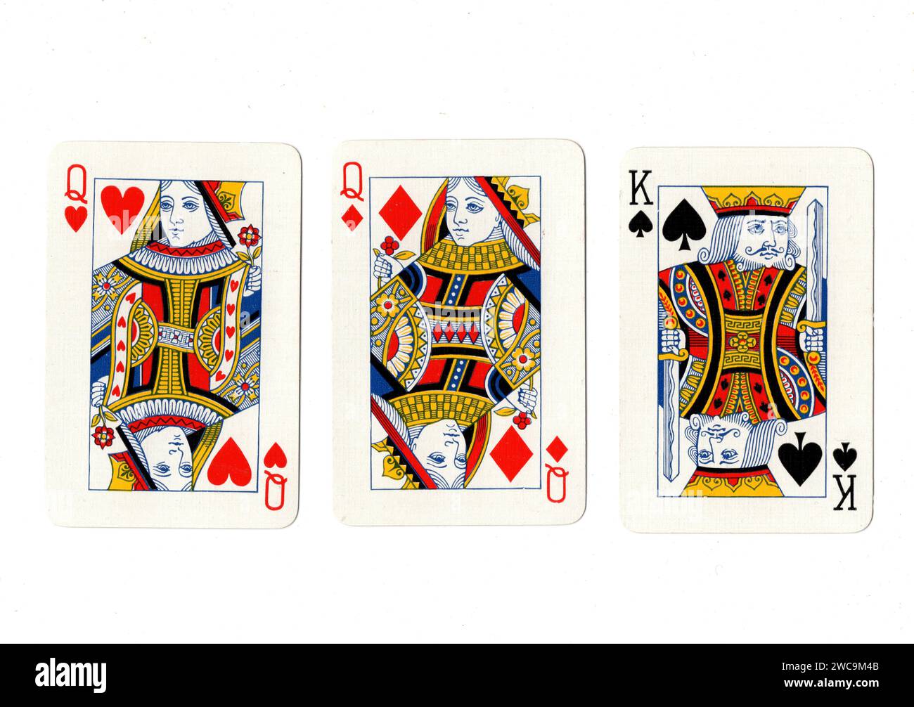 Vintage playing cards showing a pair of red queens and a black king ...