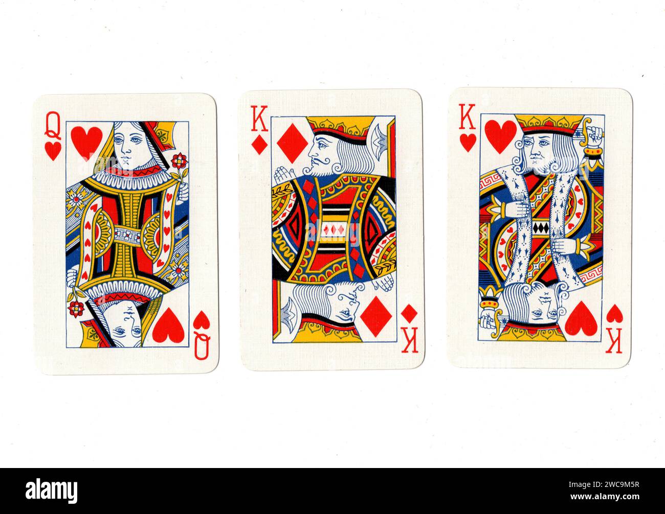 Vintage playing cards showing a pair of red kings and a red queen ...