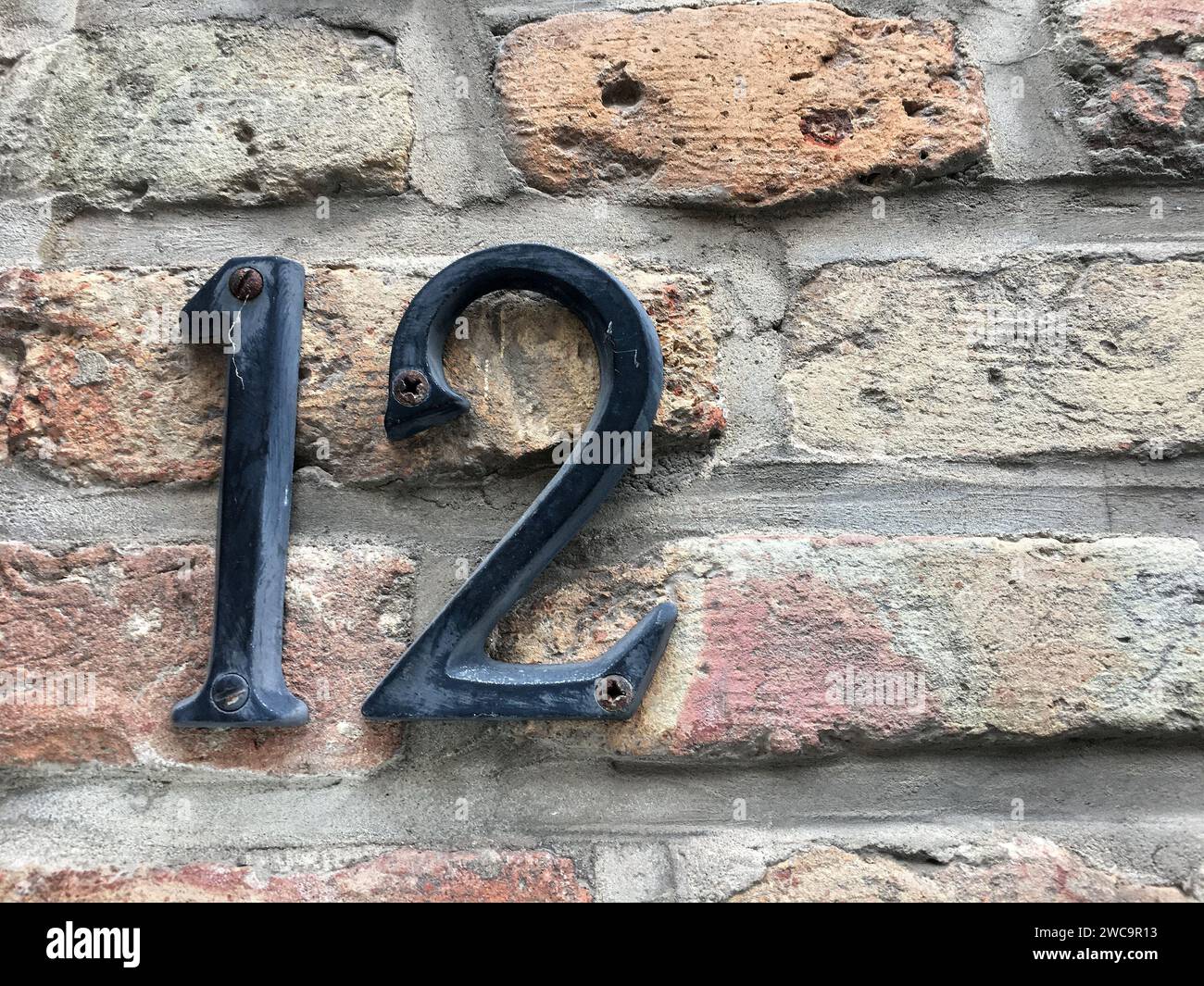 Close up of an house door number 12 Stock Photo - Alamy