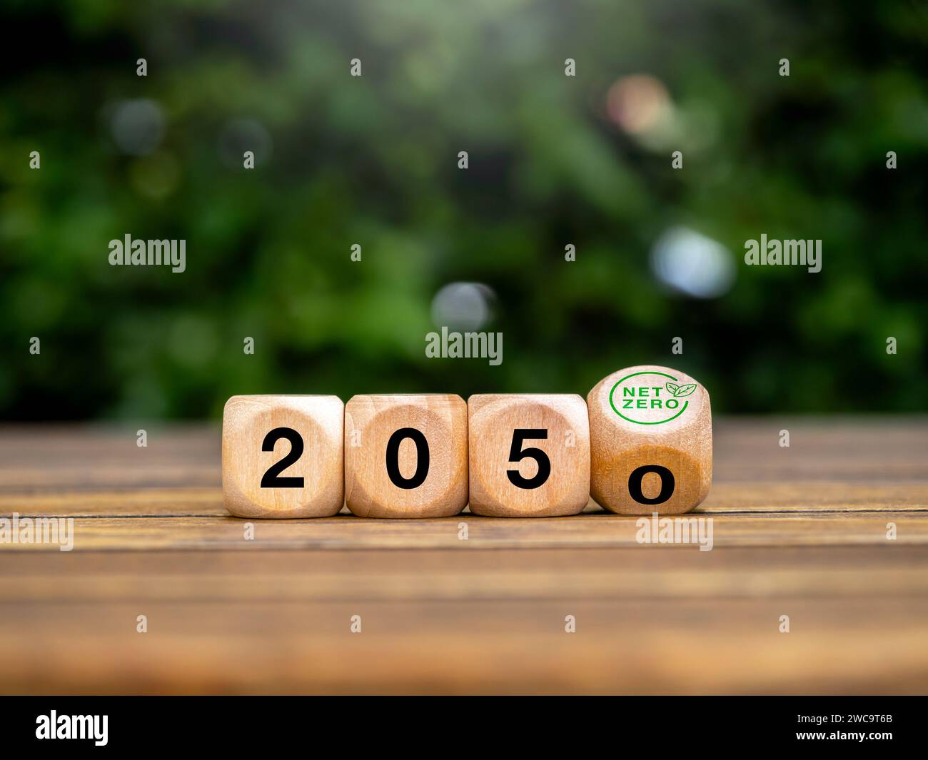 2050 year number on flipping block with green net zero icon on green ...