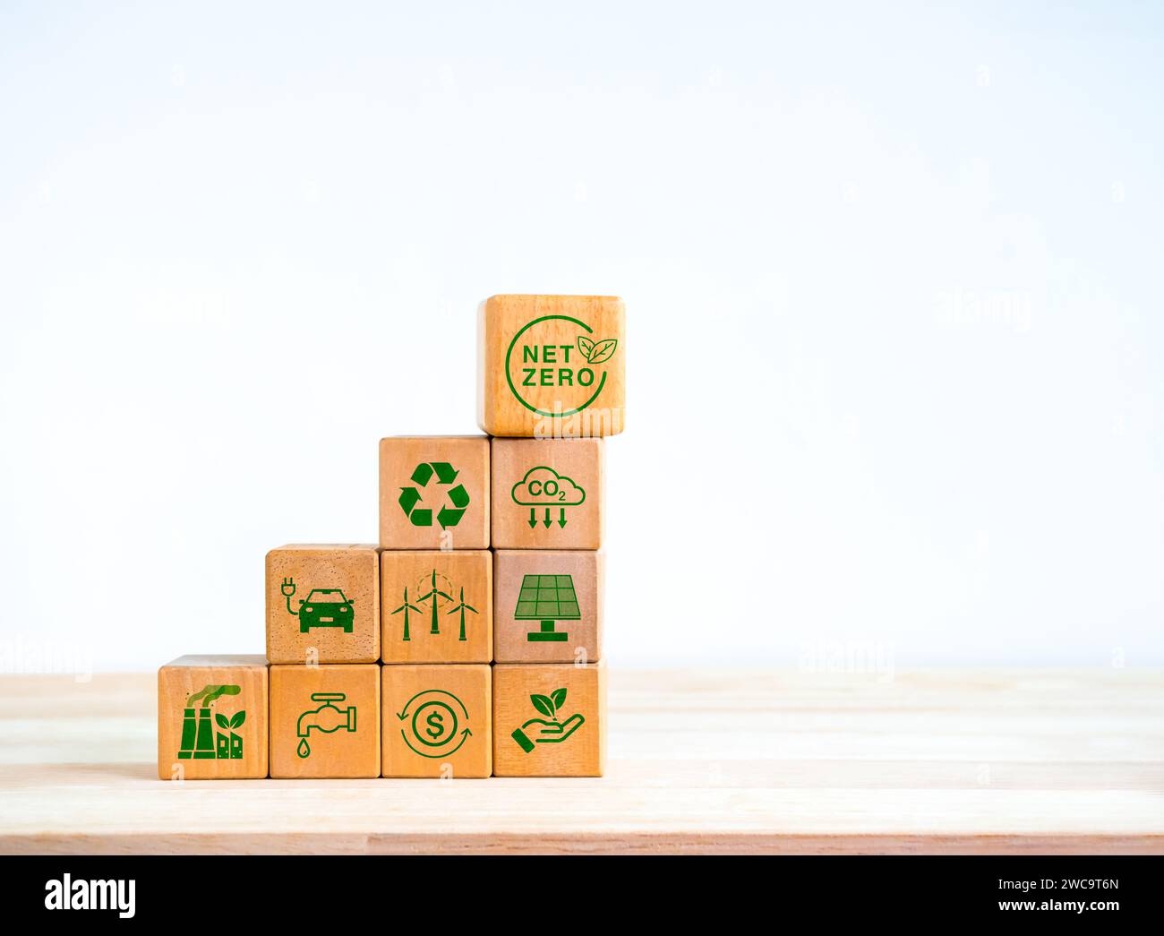 Net Zero icon and green renewable energy symbol on wooden cube block ...