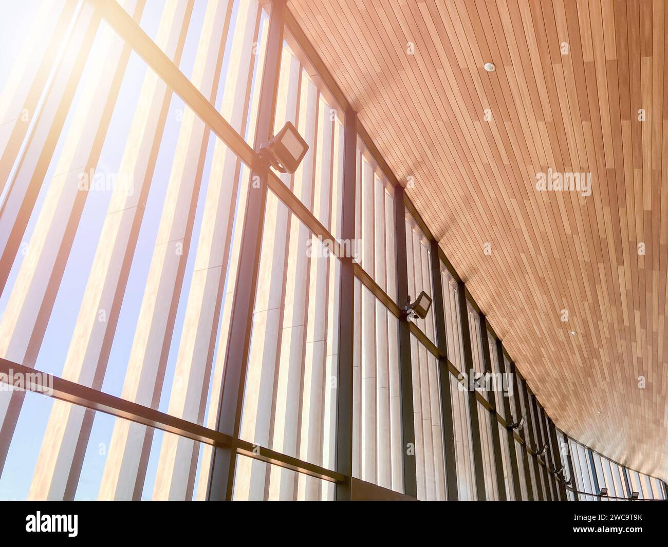 Modern business building background with sunlight. Huge glass window ...