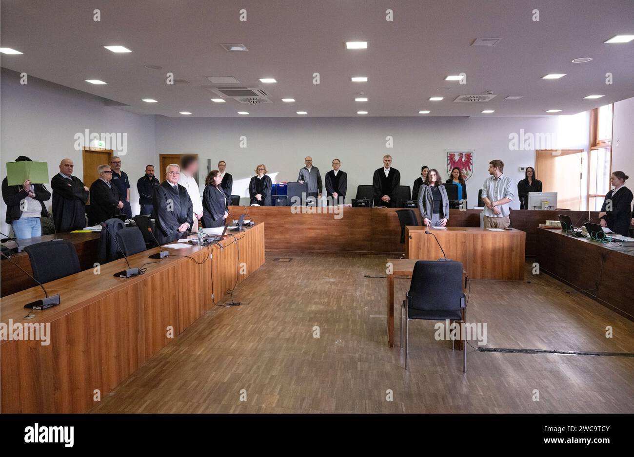 Potsdam, Germany. 15th Jan, 2024. The two defendants (left and 7th from ...