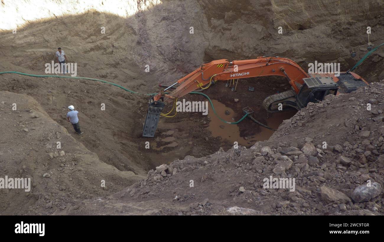 hitachi excavator at a construction site, heavy machinery for ...