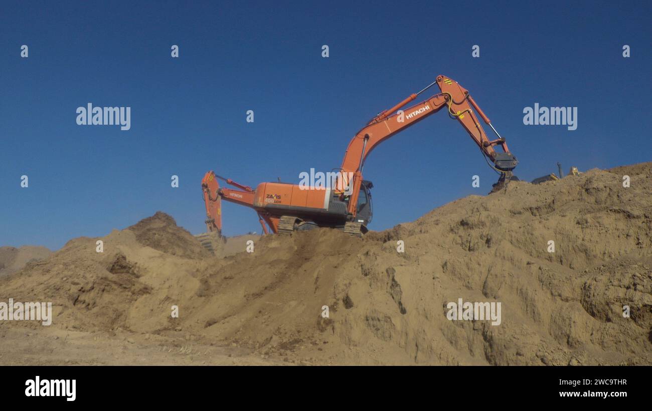 hitachi excavator at a construction site, heavy machinery for ...