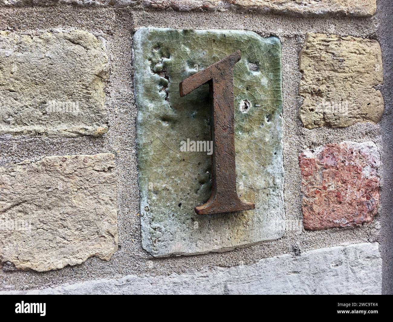 Close up of an house door number 1 Stock Photo - Alamy
