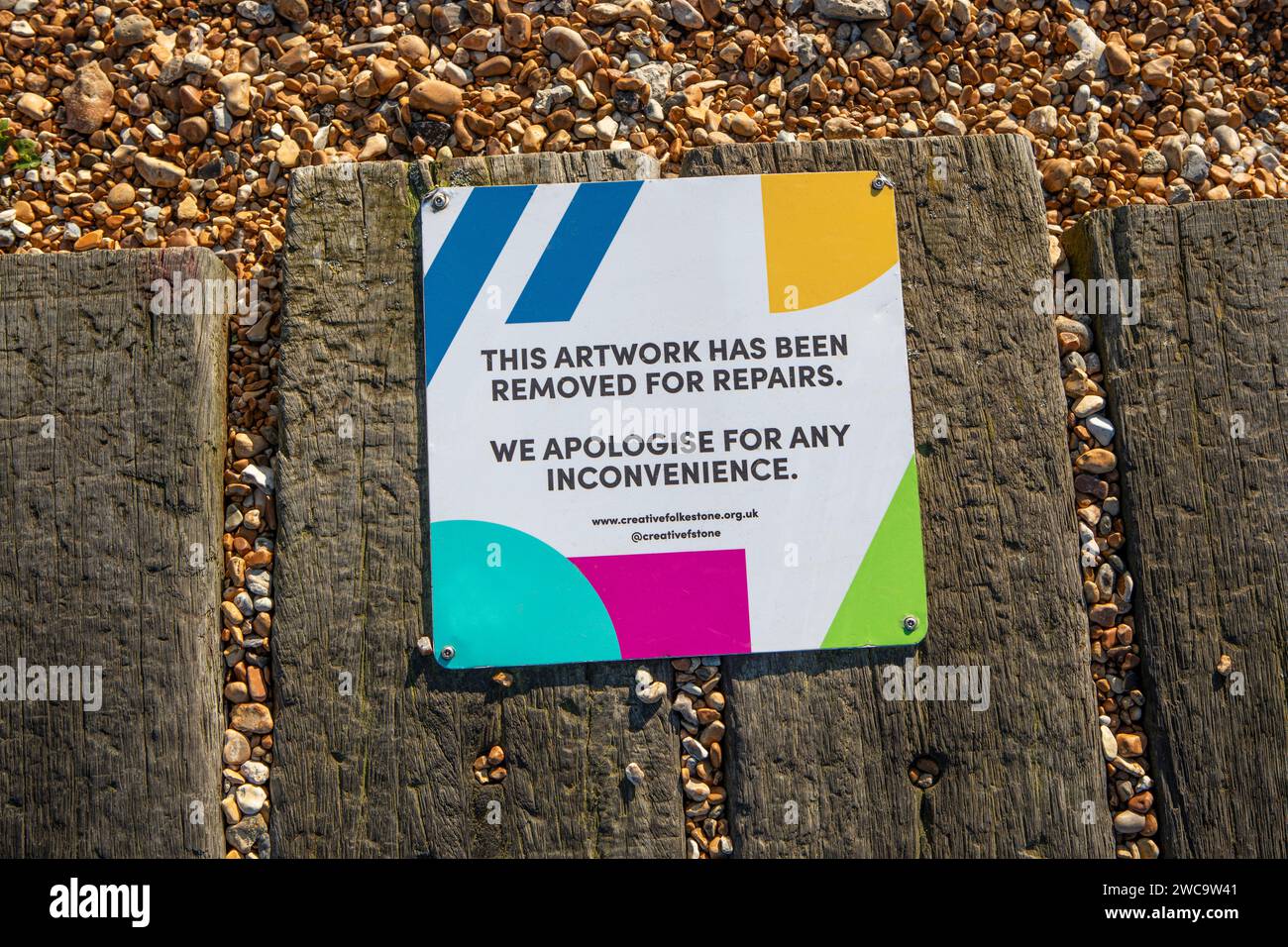 An artwork removed sign on the boardwalk on Folkestone Beach, Kent ...