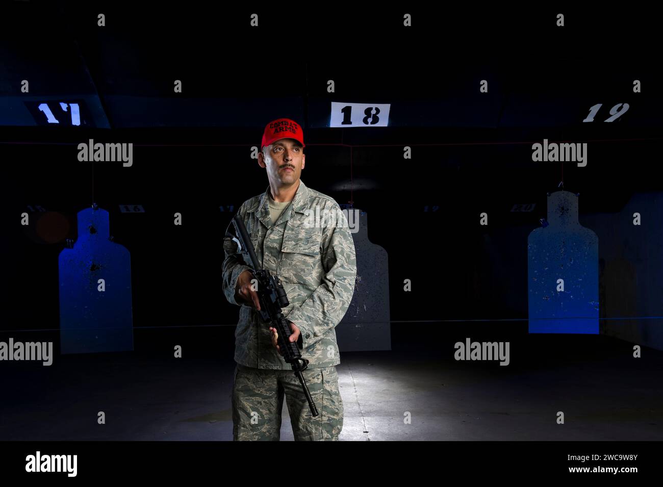 A military police officer stands at the shooting range with his rifle ...