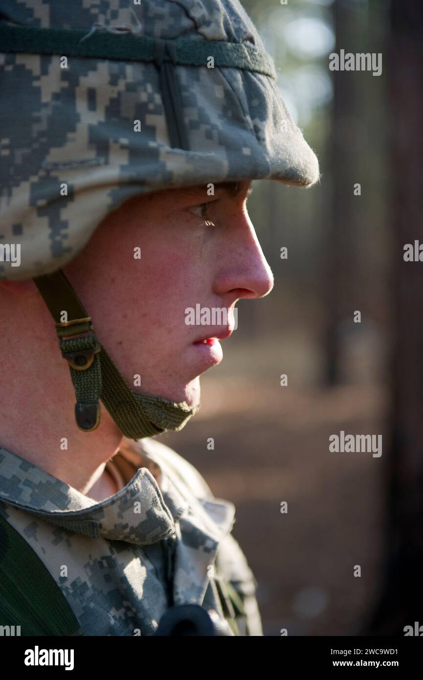 A soldier patrols through the woods during a field training exercise ...