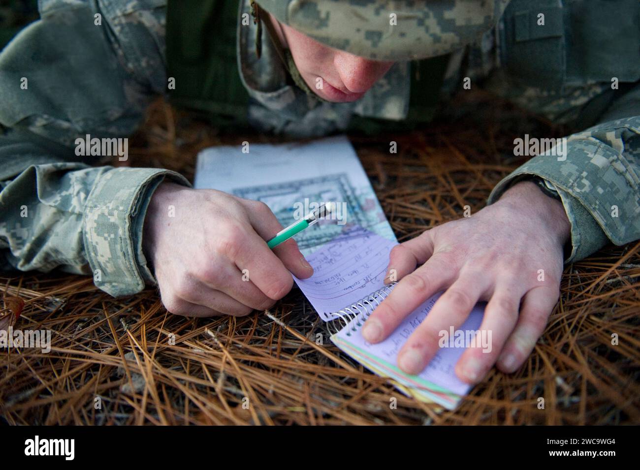 A soldier uses a map during a field training exercise Stock Photo - Alamy