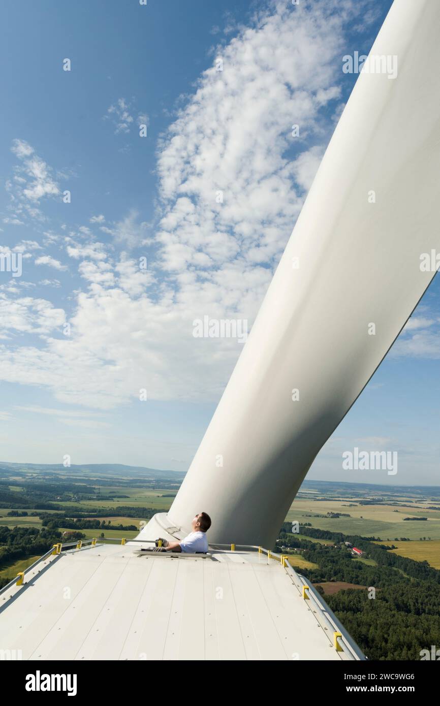 A man examines the blades of his wind turbine near Chodov, the Czech ...