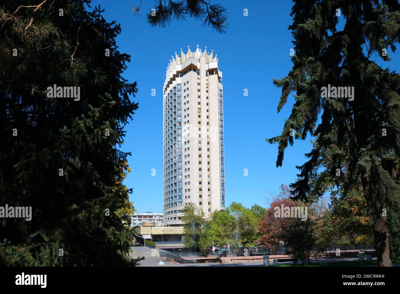 A view through the trees of the iconic, 26 floor Hotel Kazakhstan ...