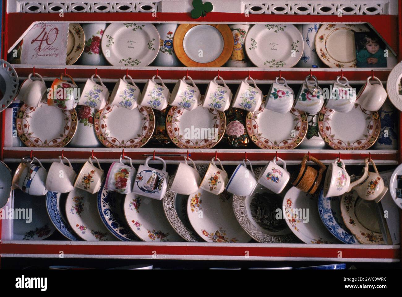 pottery cups saucers hanging display in home irish ireland Stock Photo ...